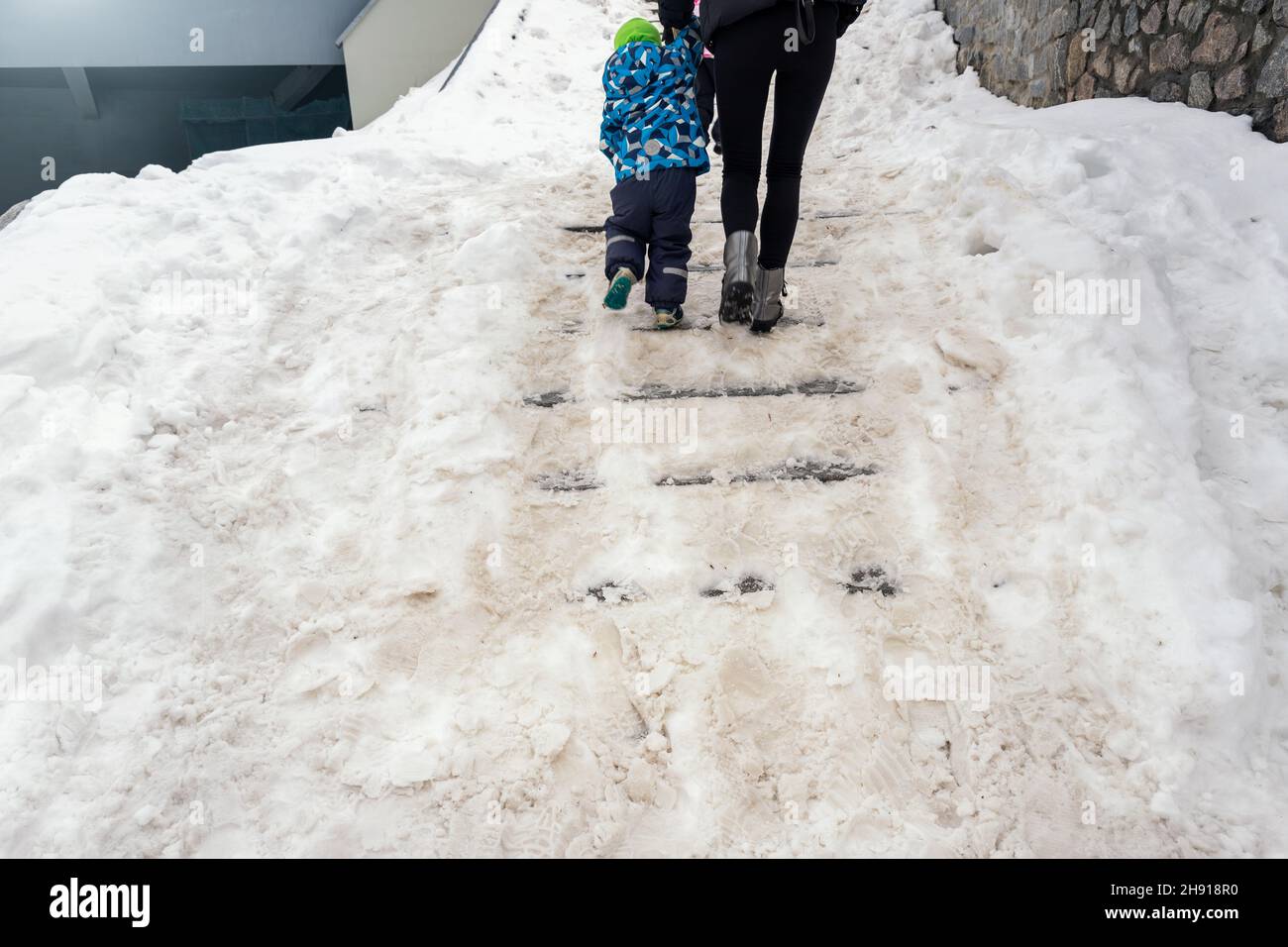 People walk by concrete stone staircase covered dirty deep slippery ...