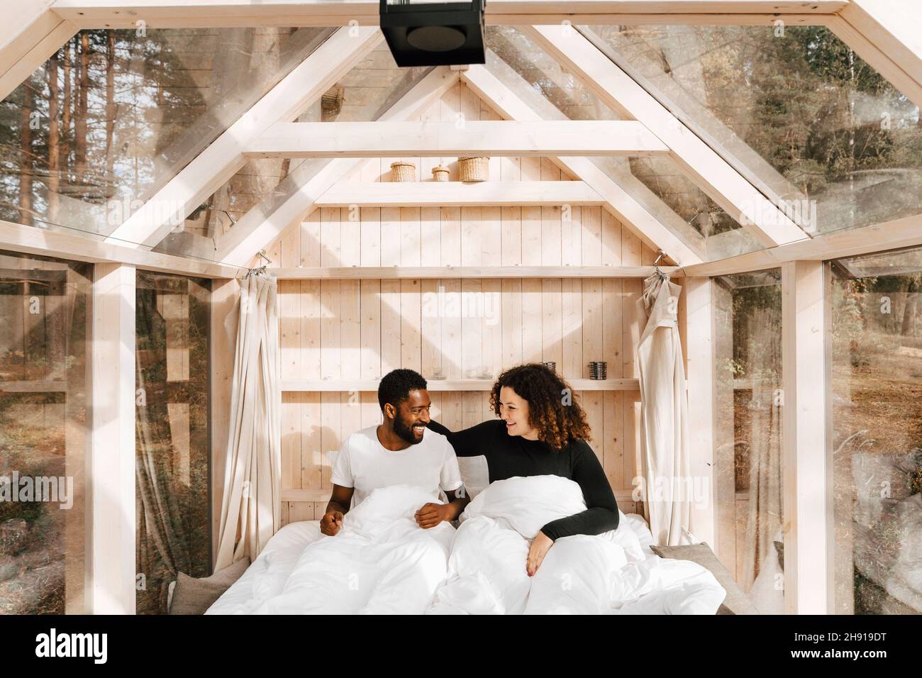 Adult couple waking up in bed hi-res stock photography and images - Alamy