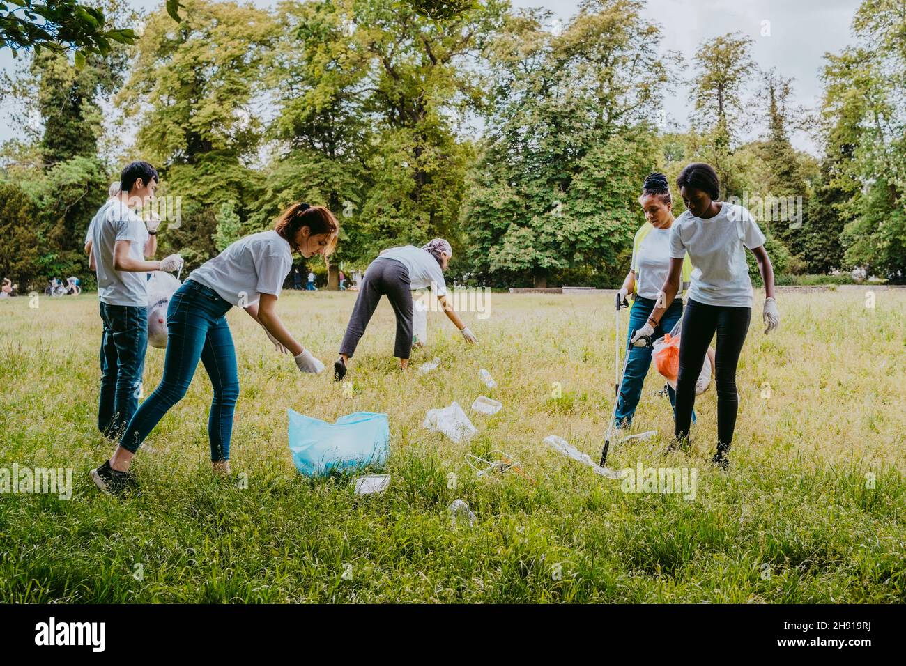 Young volunteers cleaning environment hi-res stock photography and ...