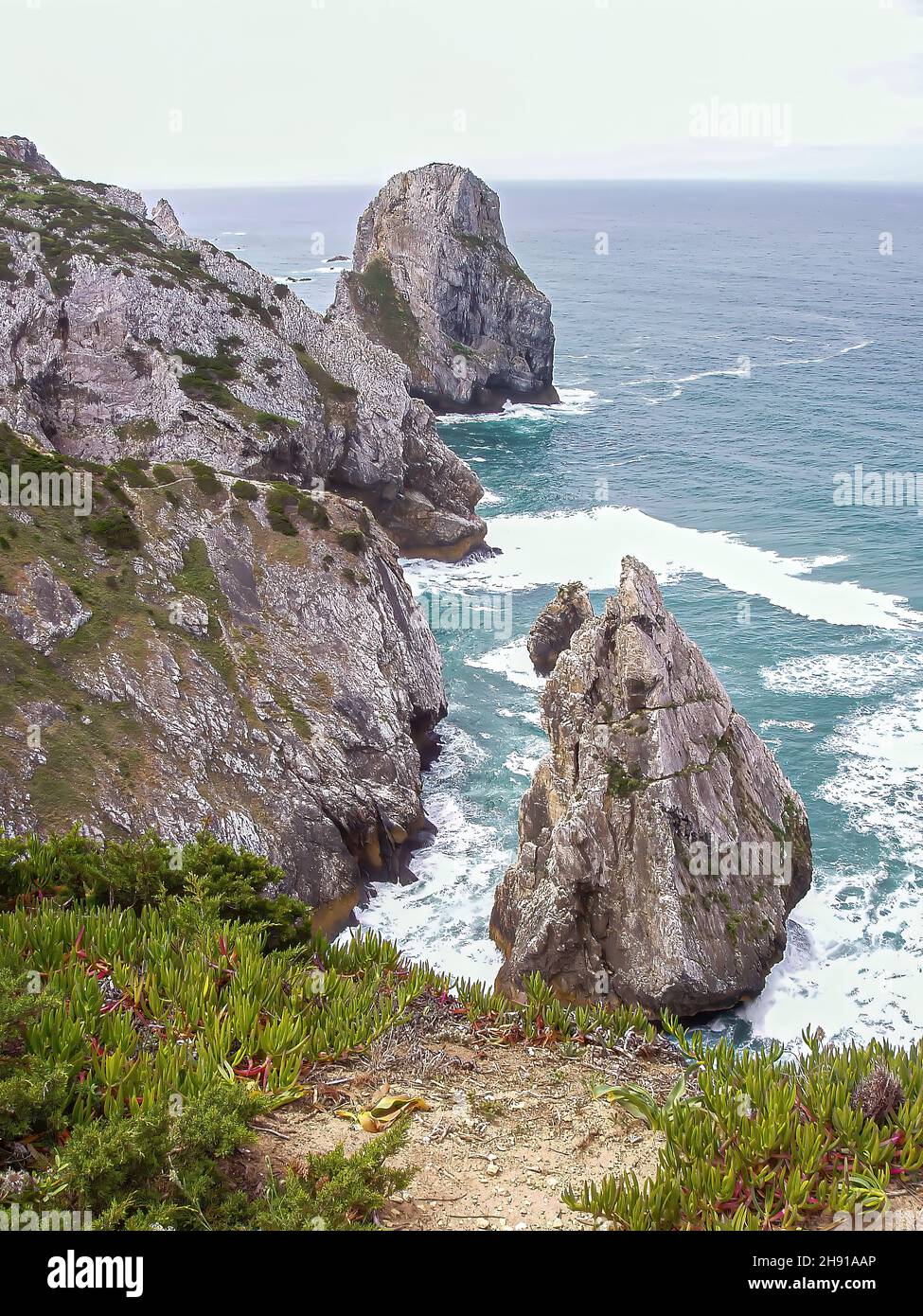 Beautiful view of a sea surrounded by cliffs under a bright sky Stock ...