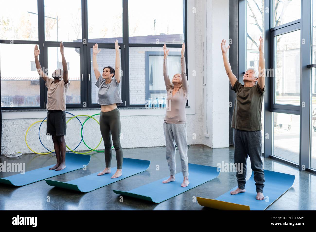 People raising hands hi-res stock photography and images - Alamy