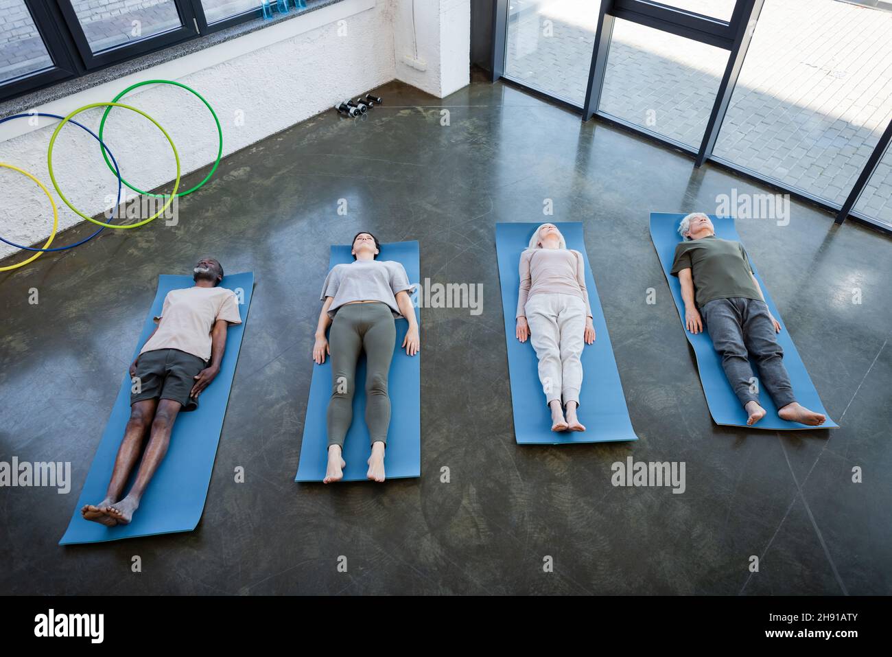 People lying in gym hi-res stock photography and images - Alamy