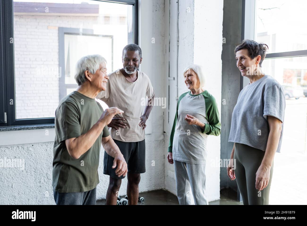 Cheerful multicultural elderly people standing in gym Stock Photo - Alamy Cheerful multicultural elderly people standing in gym Stock Photo - Alamy