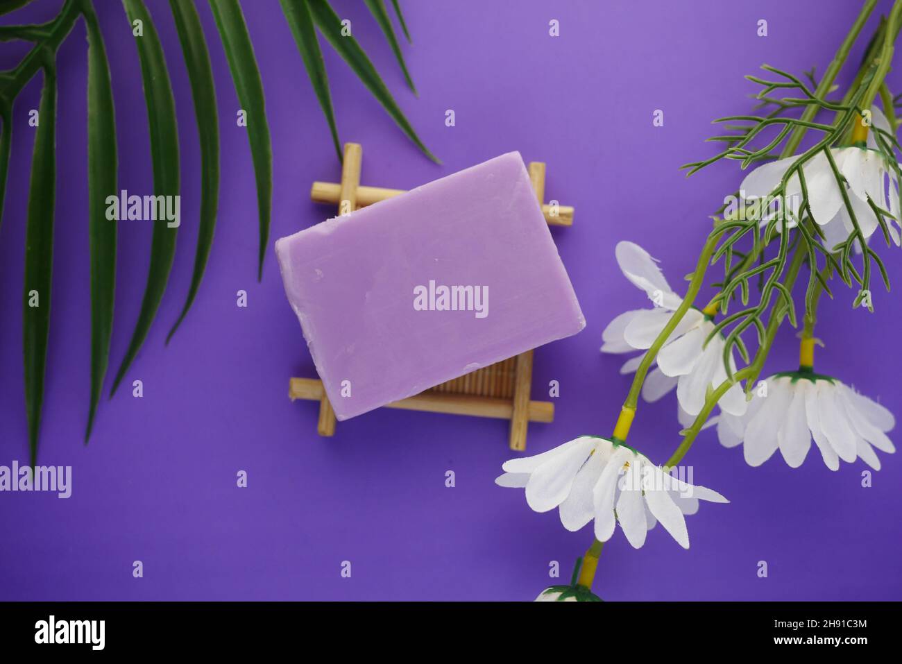 Homemade natural soap bar on purple background Stock Photo - Alamy