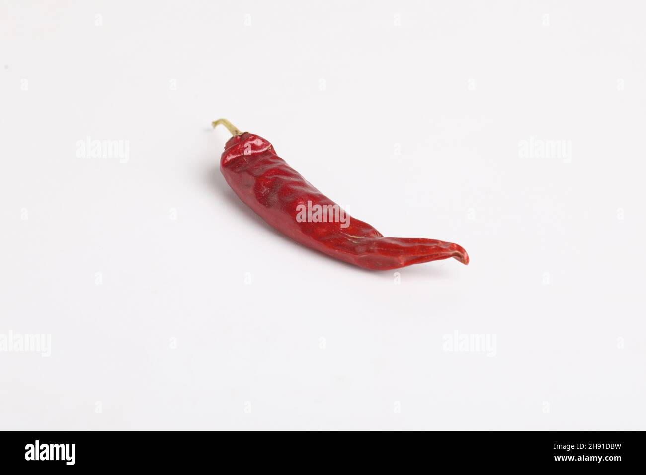 dry red chilly on white background Stock Photo - Alamy