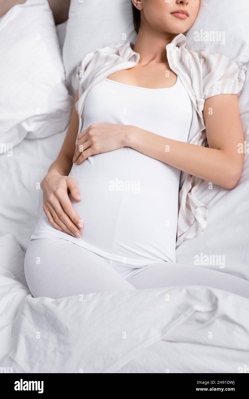 Pregnant woman in bed hi-res stock photography and images - Alamy