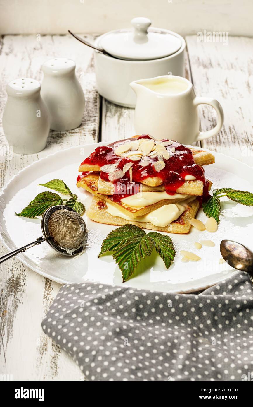 Traditional delicious pancakes with strawberry jam. Tasty breakfast ...