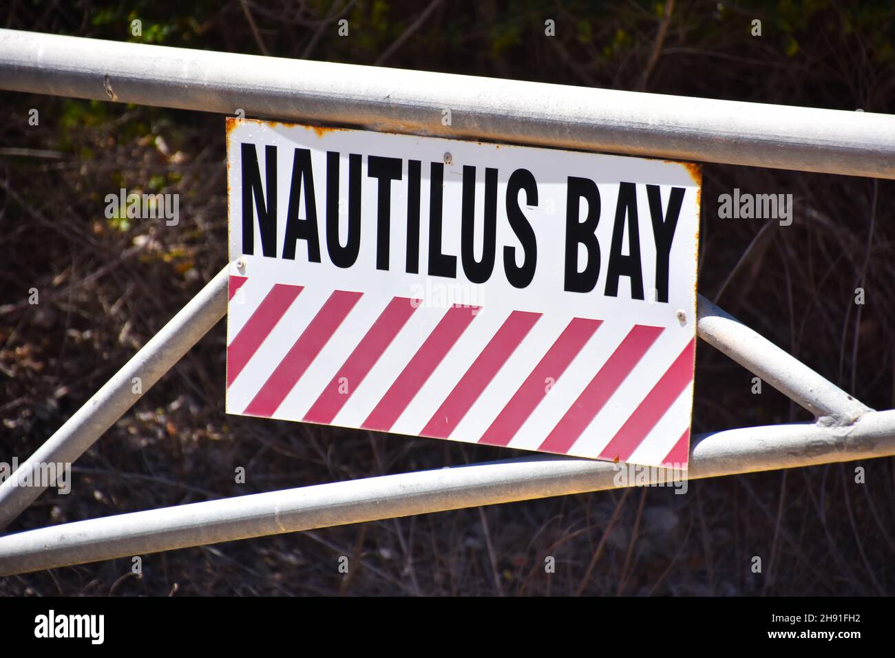 A sign of nautilus bay on the beach near the Indian Ocean seen from the ...