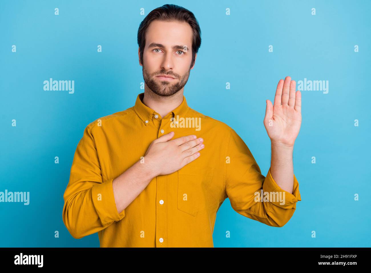 Photo of focused successful guy palm chest raise hand pledge vow wear ...