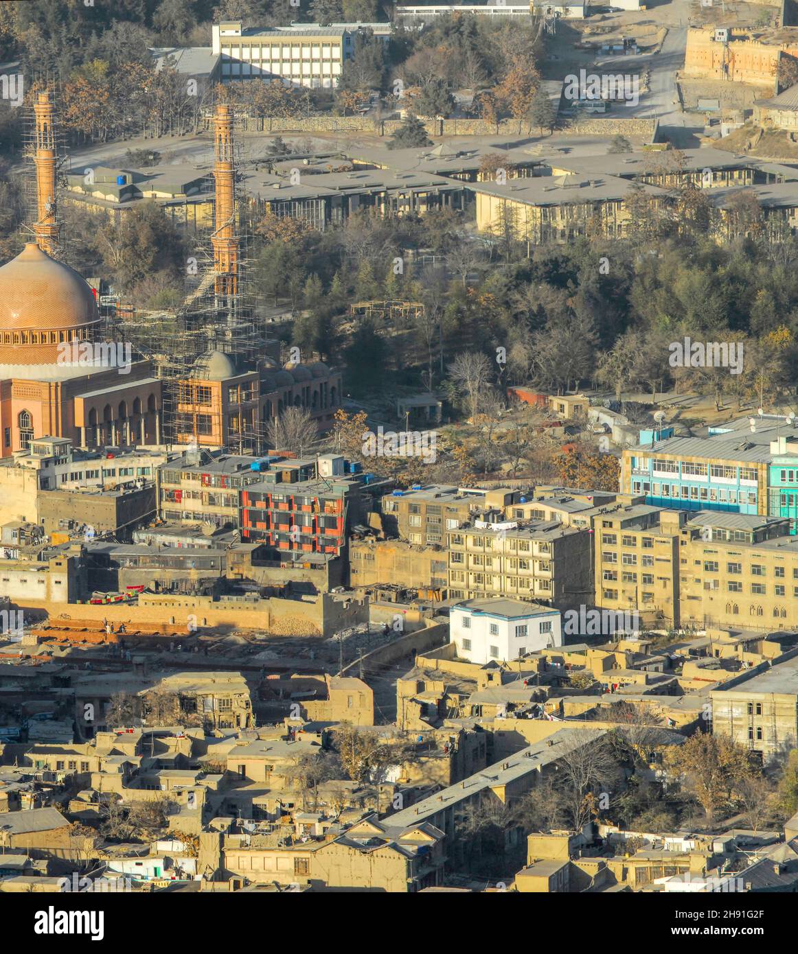 A detailed photo of the mosque under construction and other high-rises ...