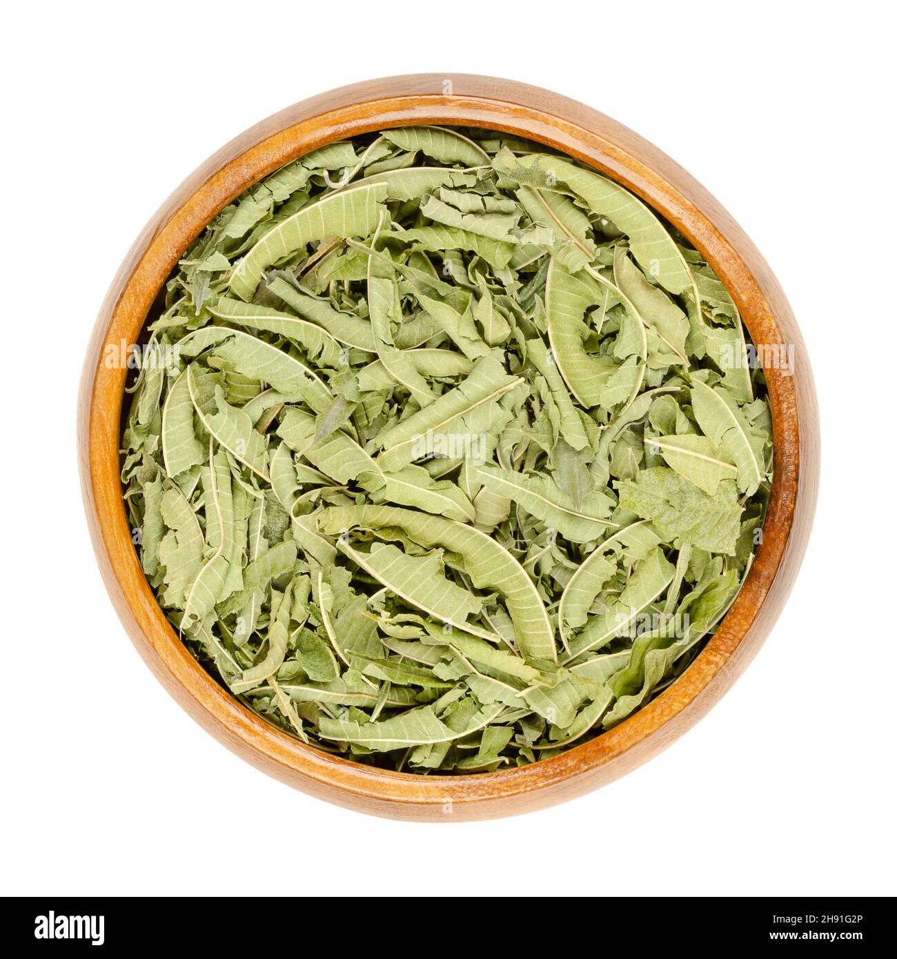 Dried lemon verbena leaves in a wooden bowl. Dry leaves of Aloysia ...