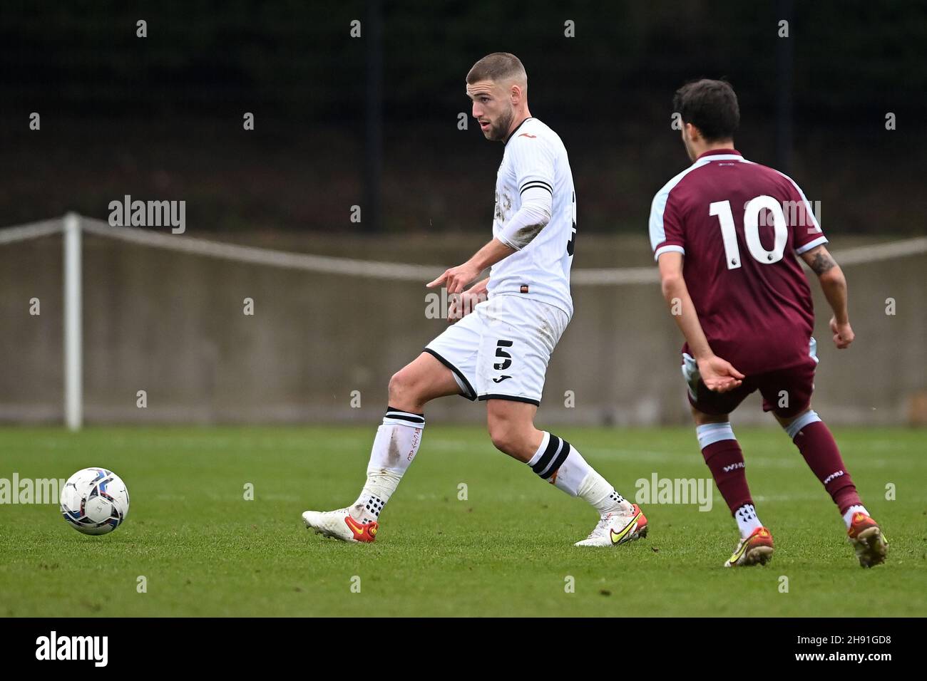 Brandon Cooper #5 of Swansea City U23's under pressure from Bernardo ...