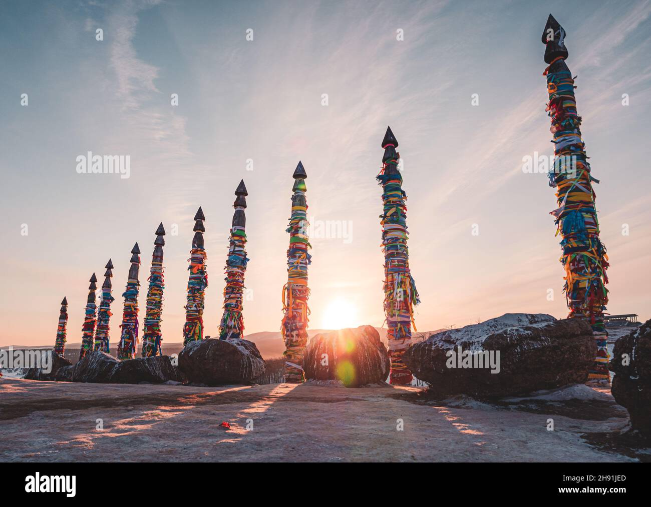 Traditional buryat shaman sacred pillars with colorful ribbons in ...