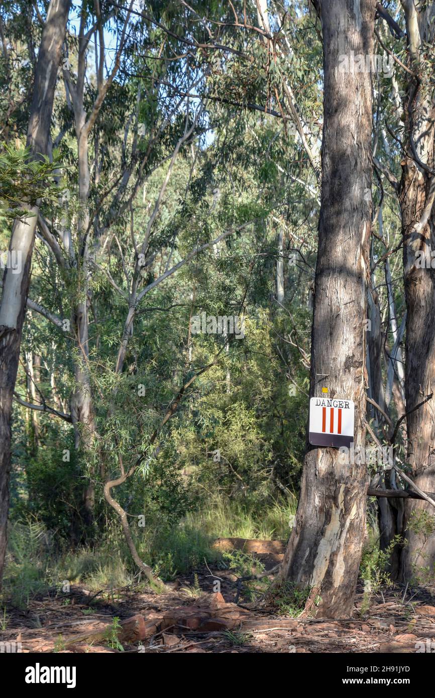 A danger sign with a unique design with black and red bright colors on ...