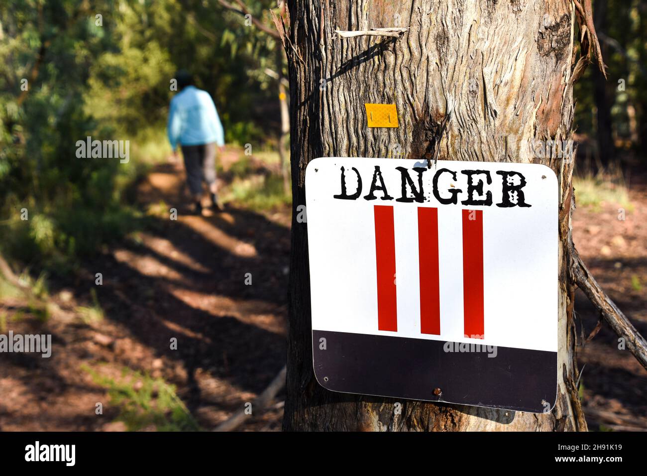 A danger sign with a unique design with black and red bright colors on ...