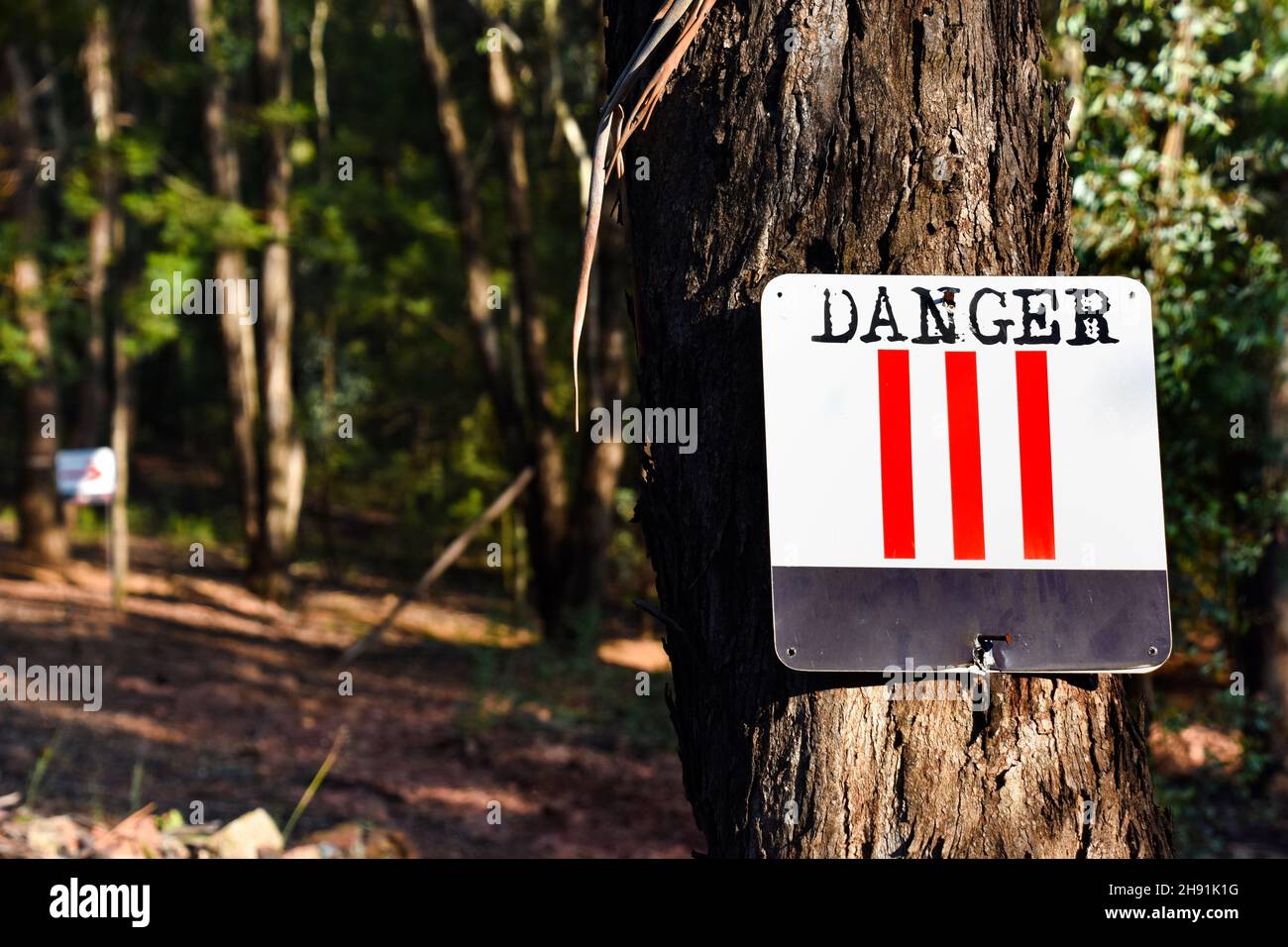 A danger sign with a unique design with black and red bright colors on ...