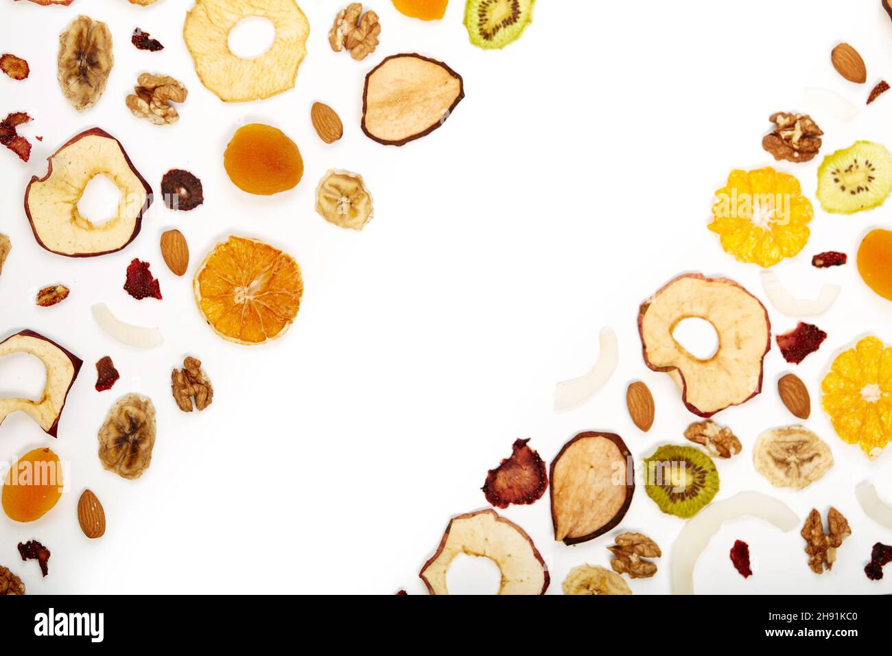Close up of natural nuts and dried fruits orange, apple, kiwi, coconut ...