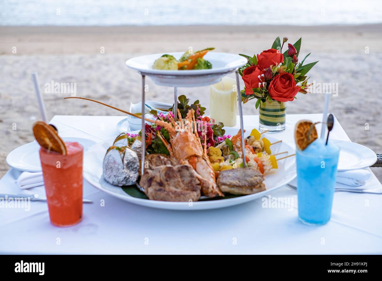 Romantic dinner on the beach with lobster, dinner on the beach in ...