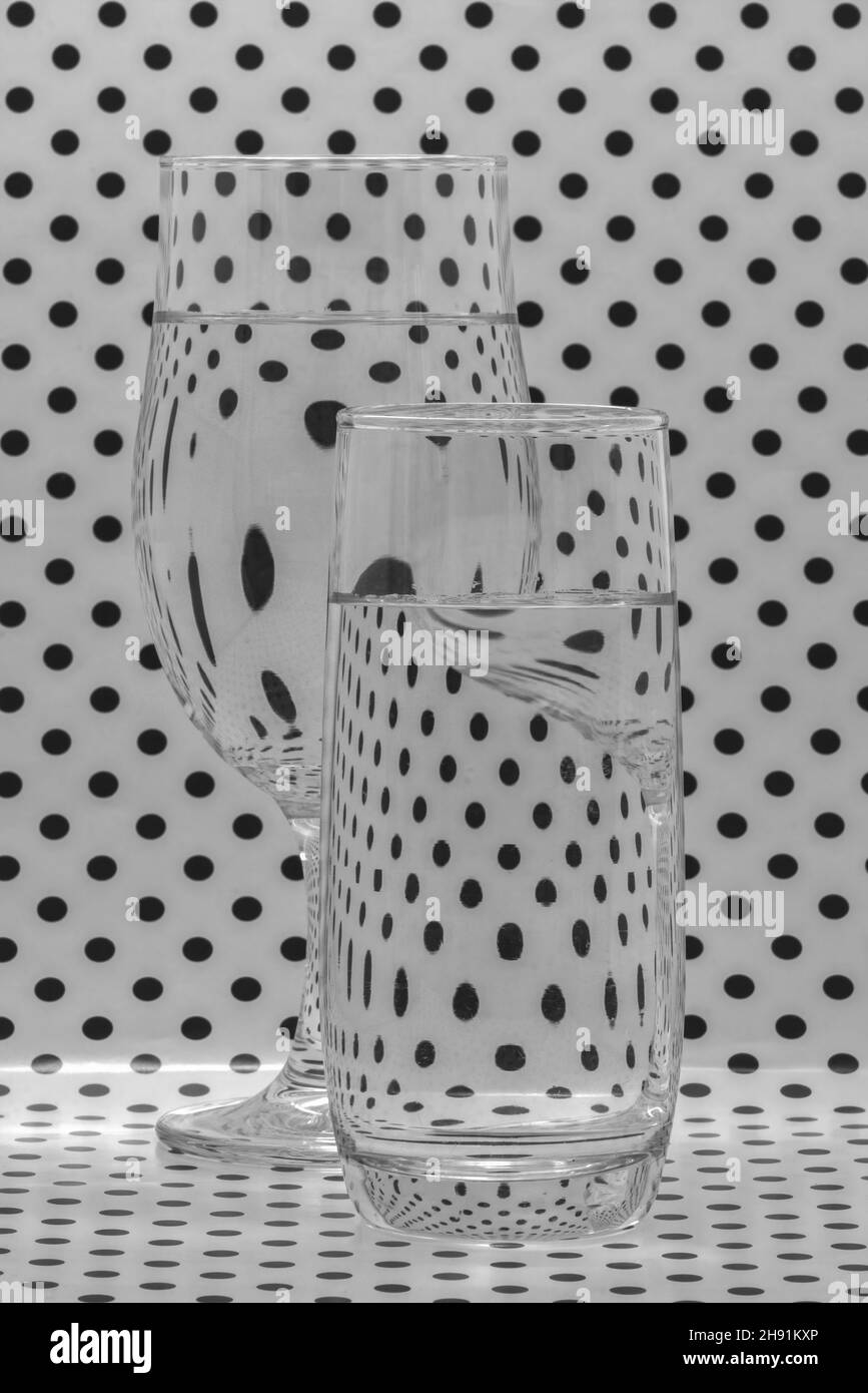 Artistic picture of spotted paper refracting through glasses creating ...