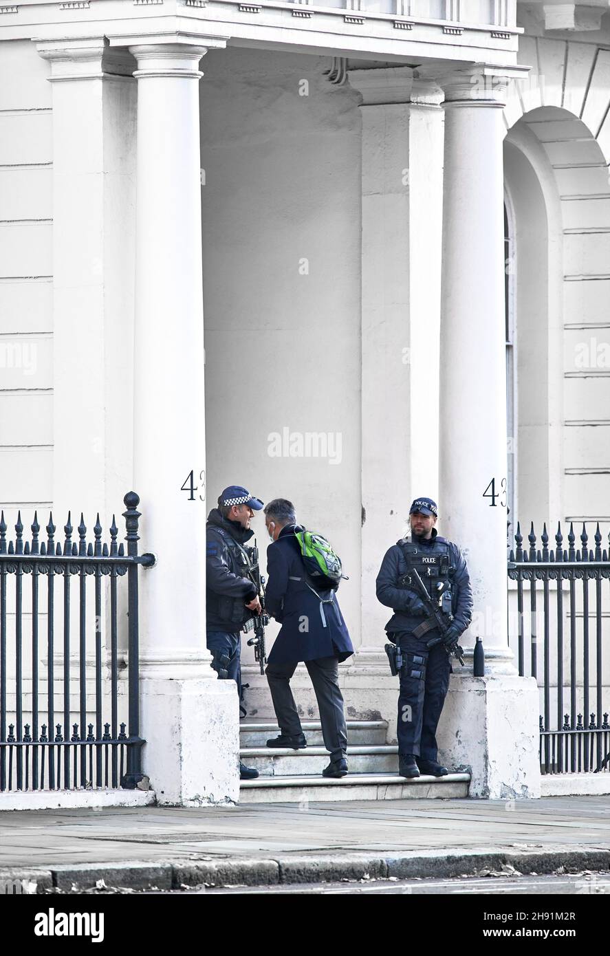 Armed police guard at the entrance to the Embassy of Turkey building ...