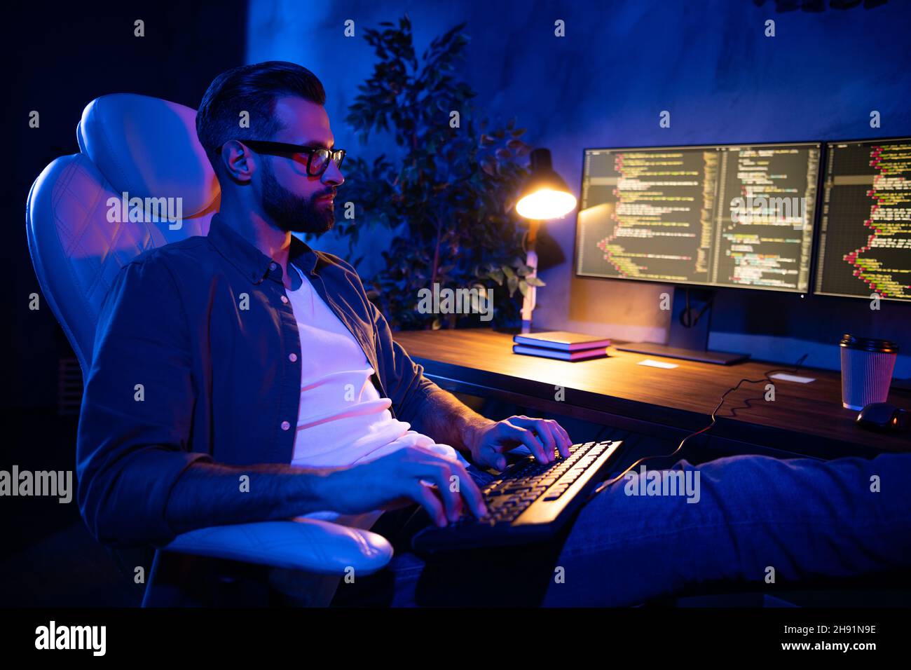 Profile portrait of professional developer sitting chair texting ...