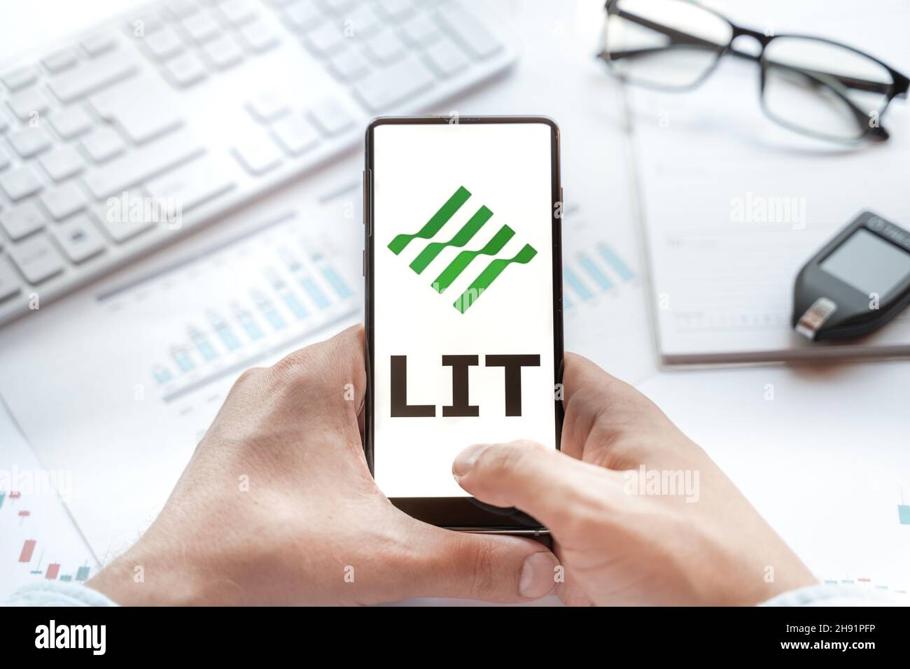 Logo of Litentry coin in tablet. Cryptocurrency LIT token. Trading blockchain platform to buy ...