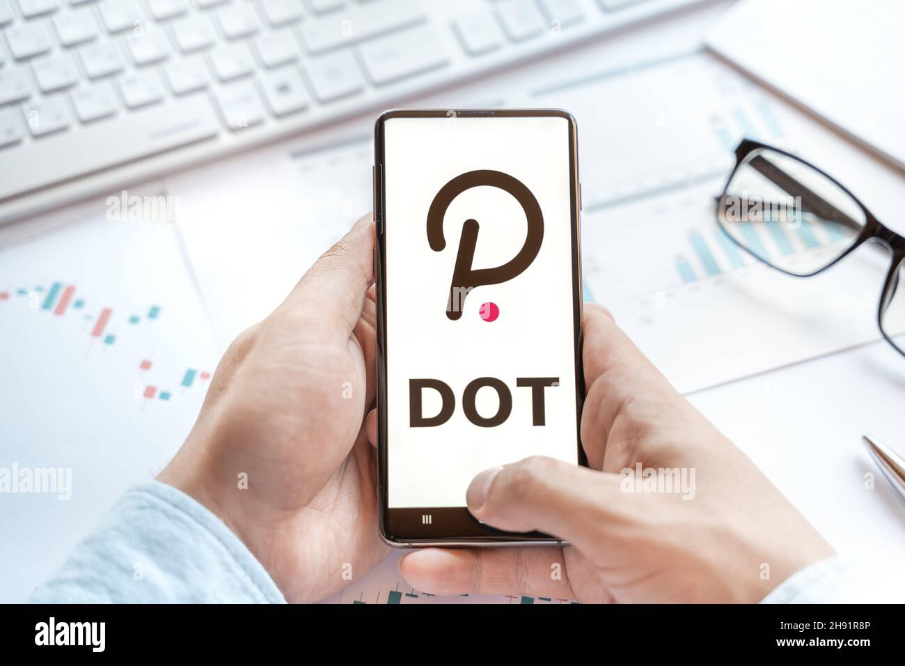 Logo of Polkadot coin in tablet. Cryptocurrency DOT token. Trading ...
