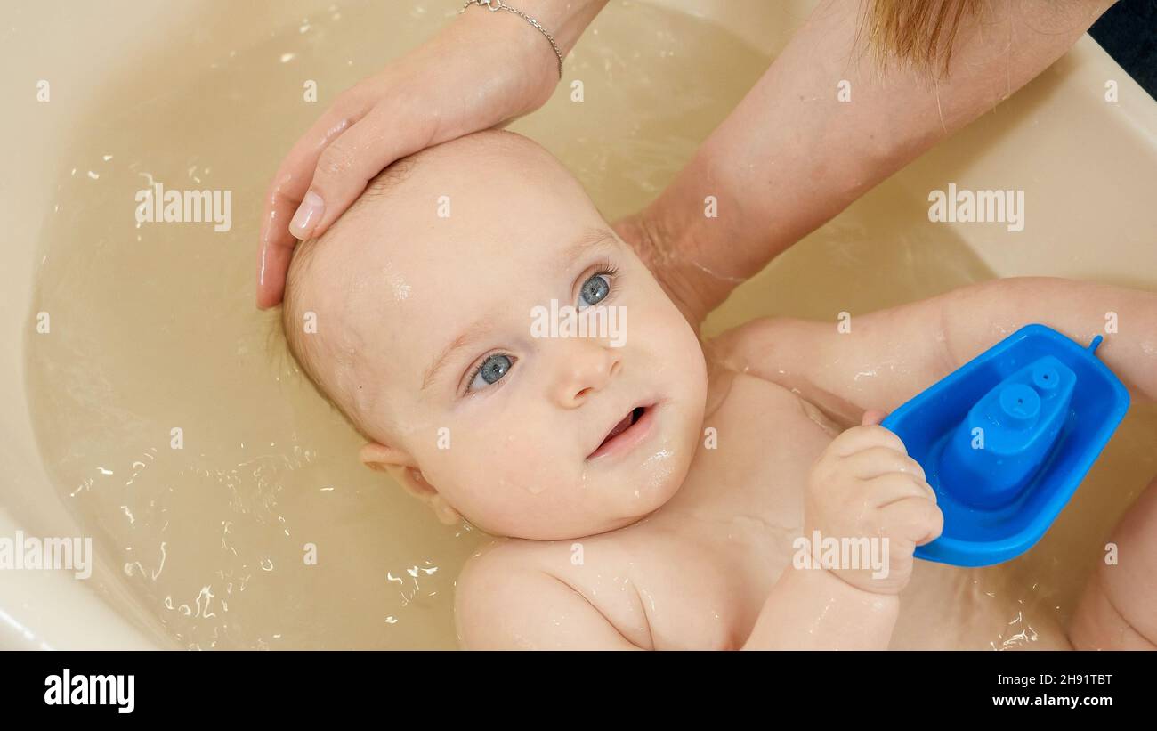Caucasian boy washing face at sink hi-res stock photography and images ...