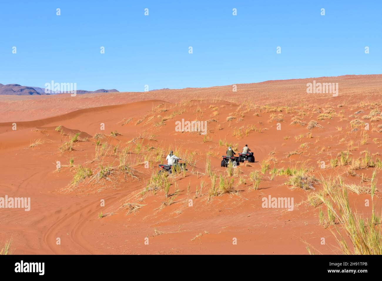 Tourists quad biking in the sossusvlei desert in Namibia Southern ...