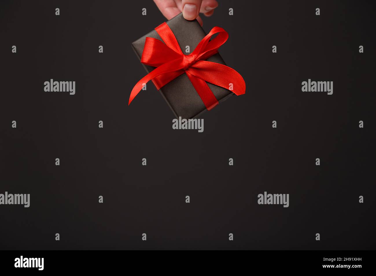 Female hand red bow hi-res stock photography and images - Alamy