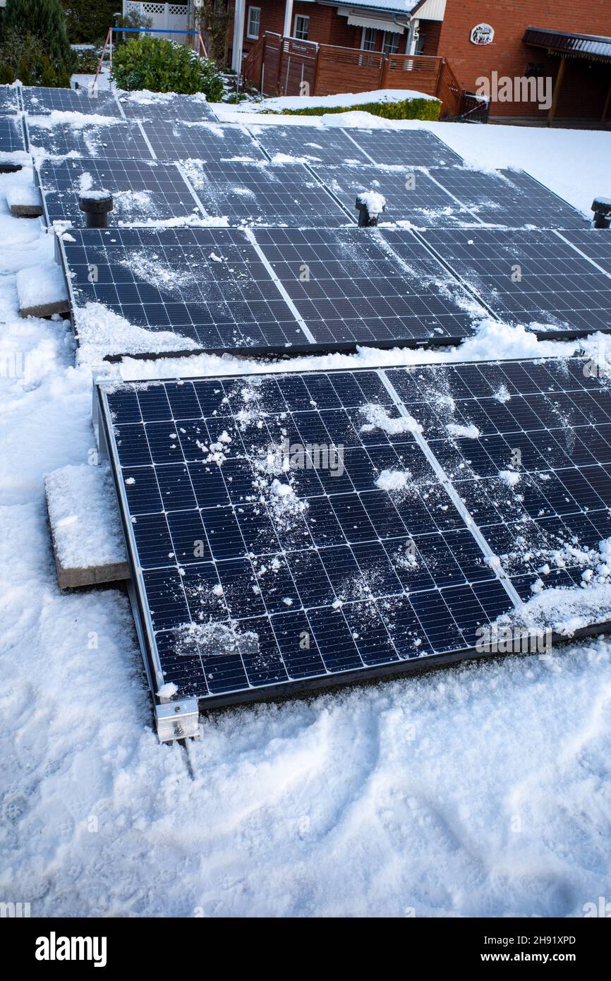 on a roof there are solar panels of a photovoltaic system, which have ...