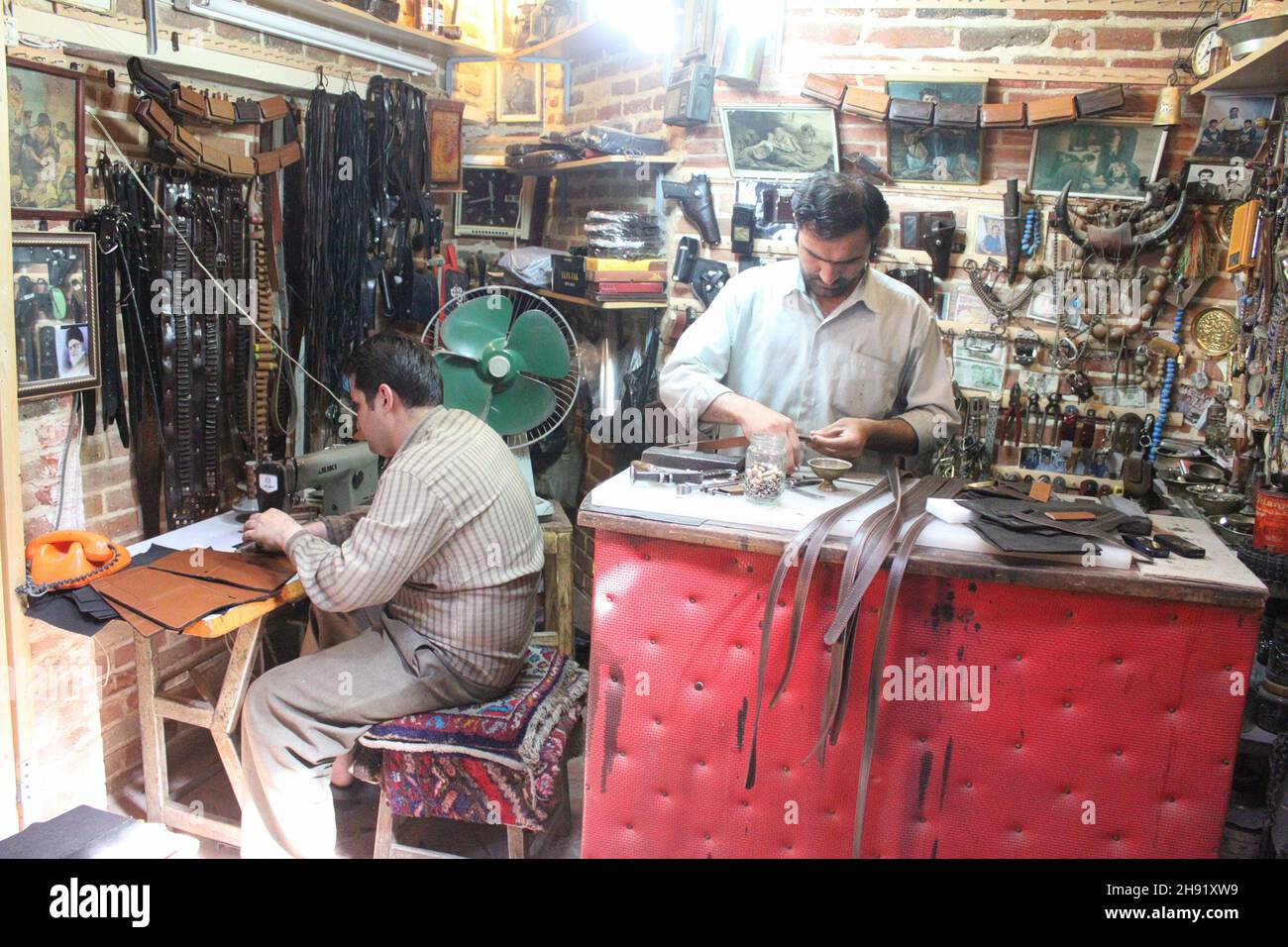 Production of leather bags and belts by hand Stock Photo - Alamy