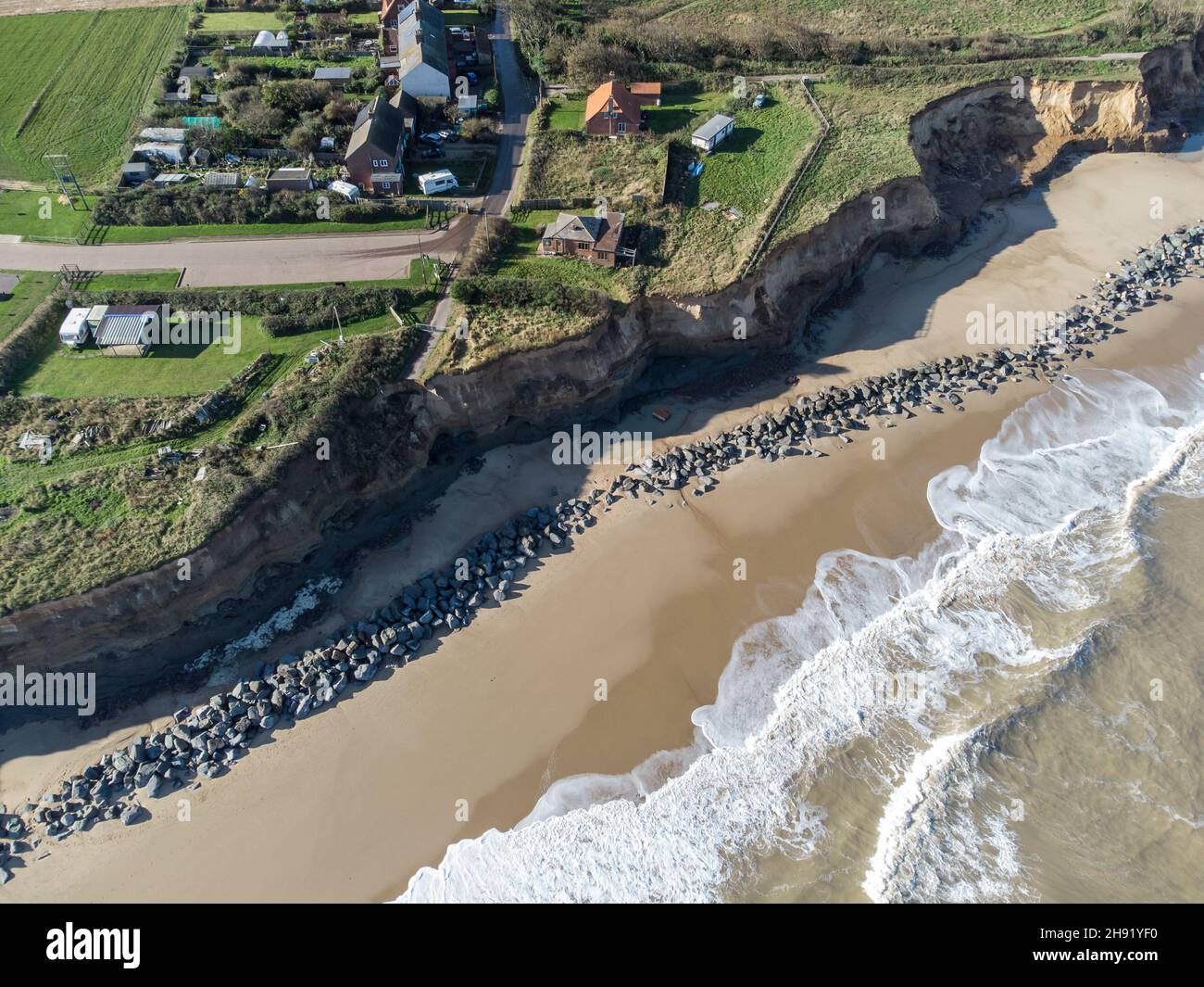 The slowly eroding East Anglian coast at Happisburgh, UK Stock Photo ...