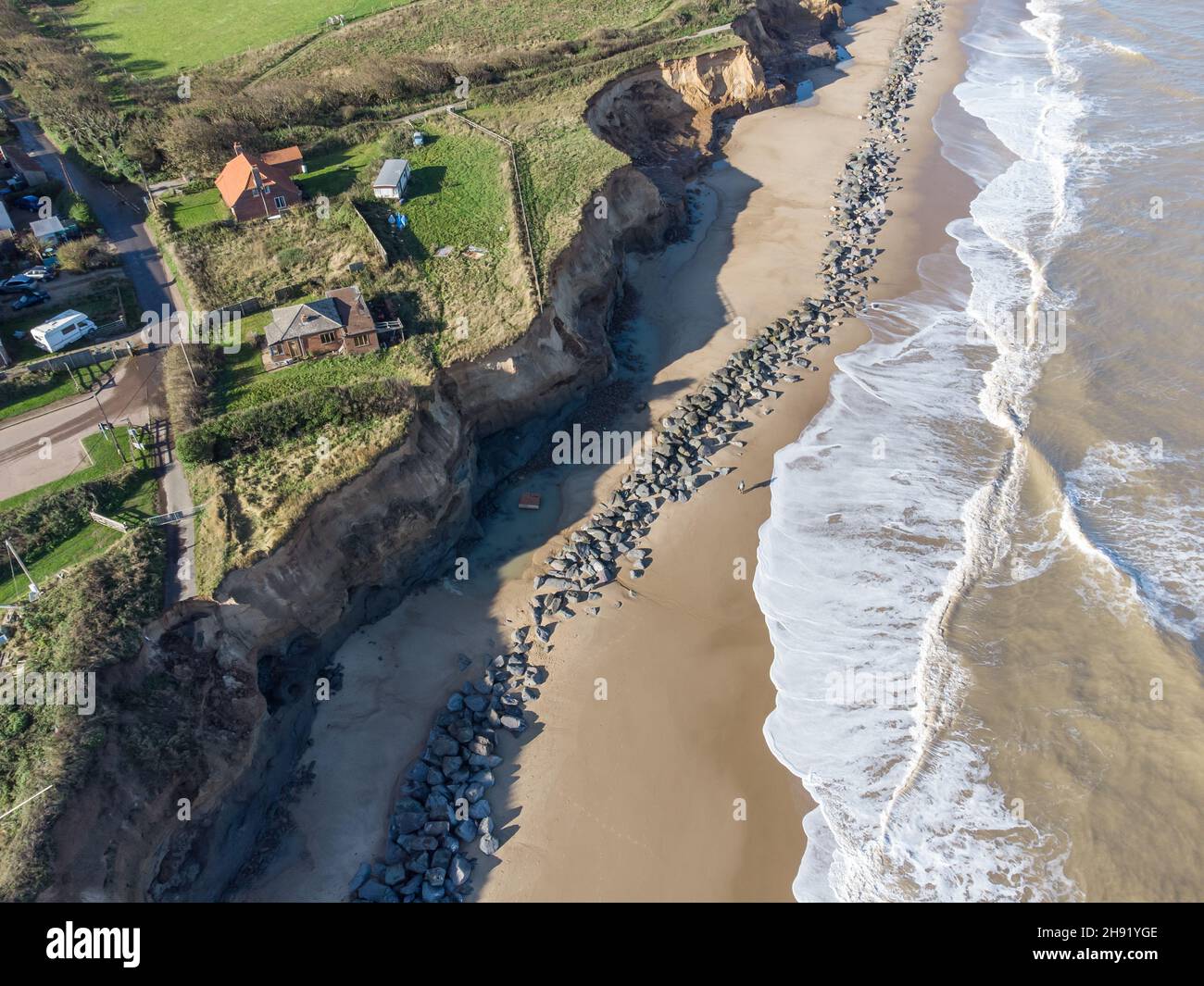 The slowly eroding East Anglian coast at Happisburgh, UK Stock Photo ...