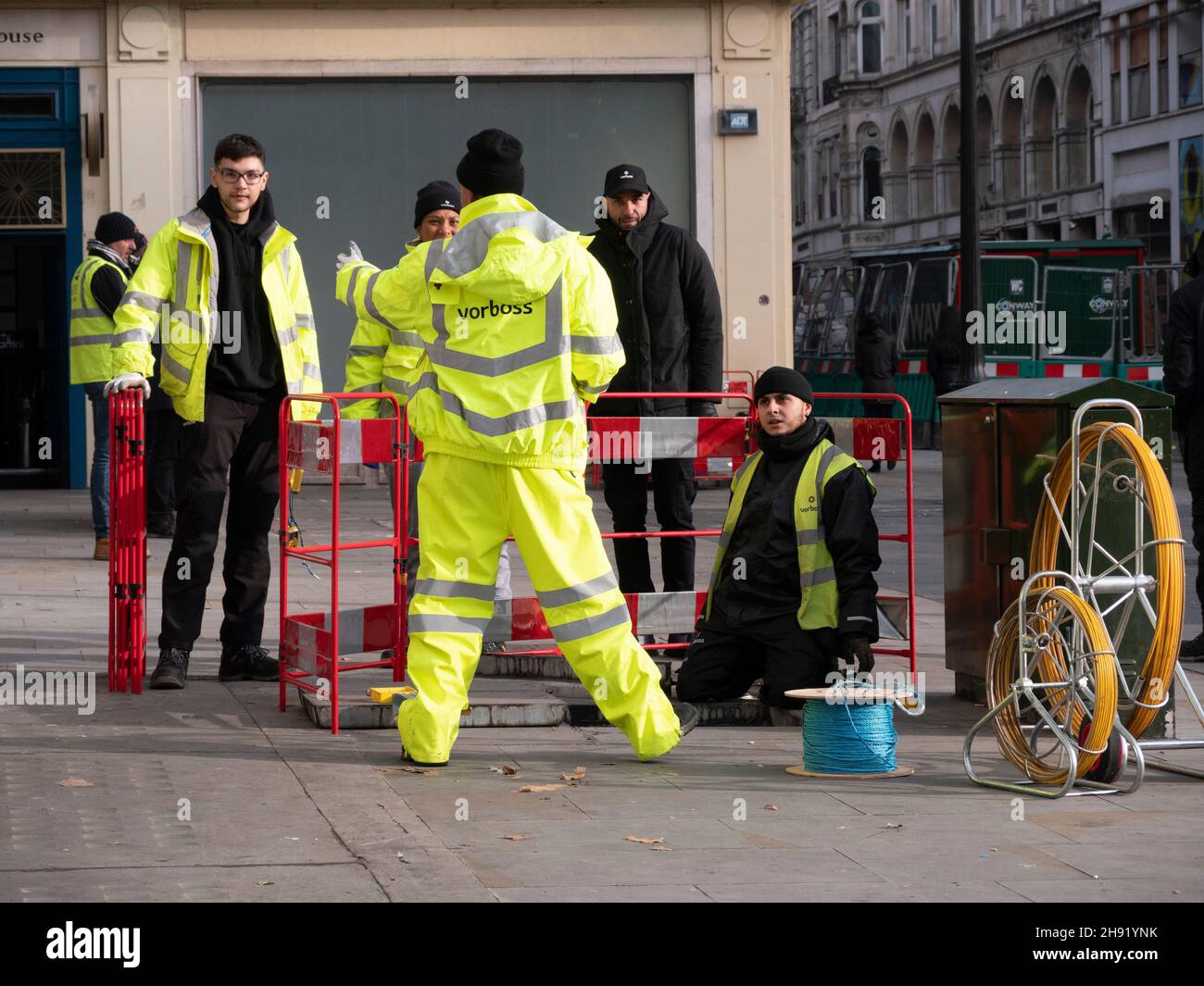 Vorboss engineers fitting cables behind street barriers for Vorboss ...