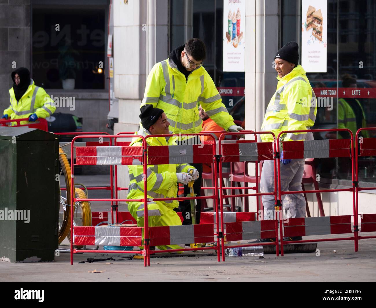 Vorboss engineers fitting cables behind street barriers for Vorboss ...