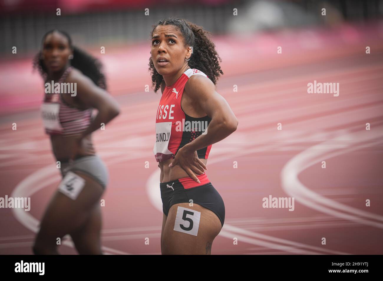 Mujinga Kambundji competing in the 100 meters of the Tokyo 2020 Olympic ...
