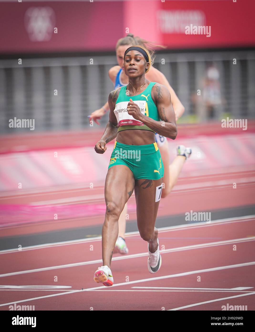 Elaine Thompson competing in the 100 meters of the Tokyo 2020 Olympic ...