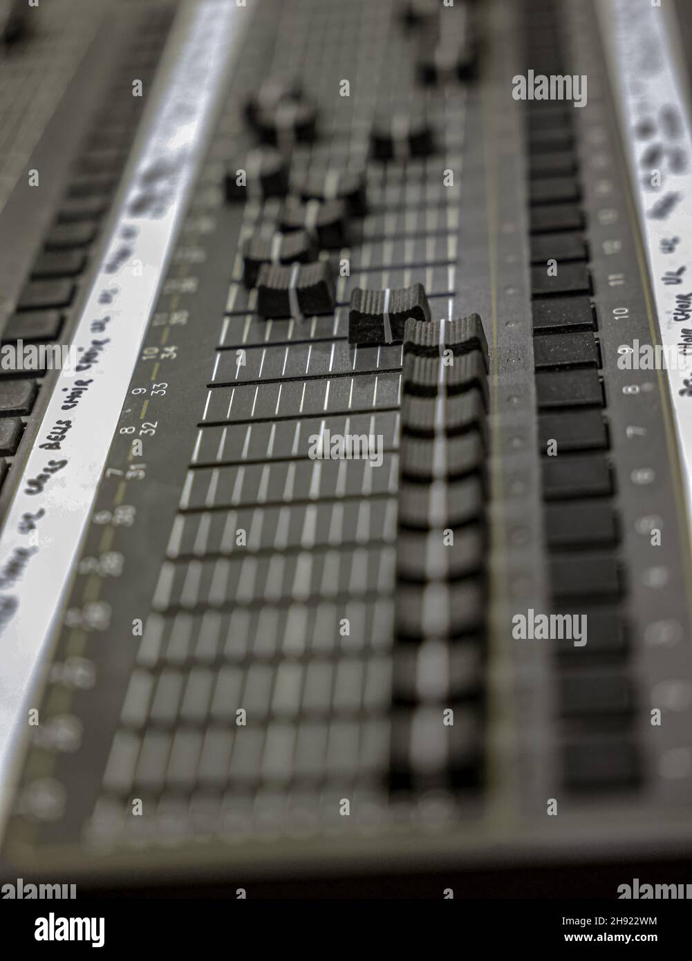 Professional sound and audio mixer control panel with buttons and ...