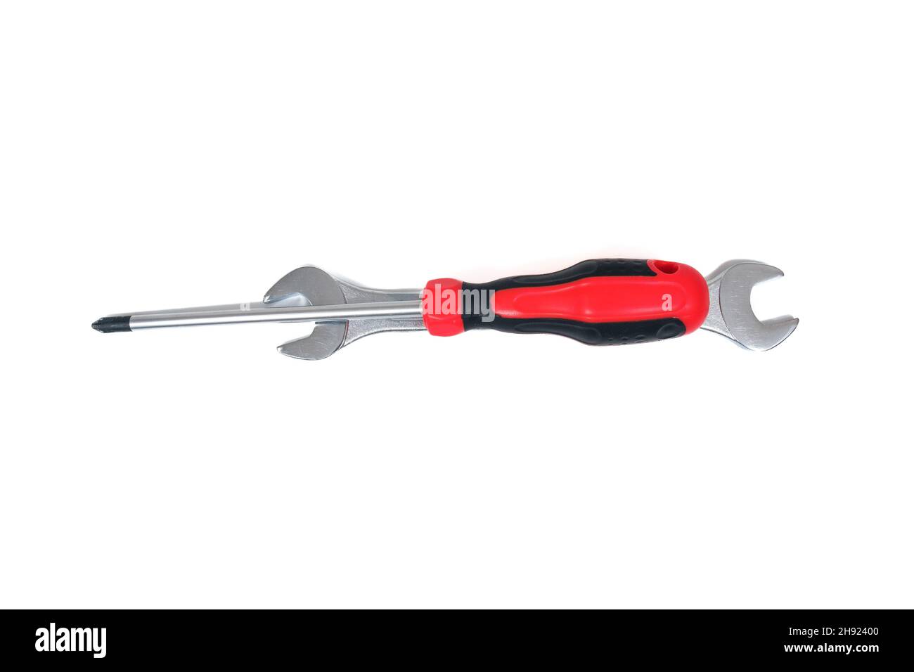 A screwdriver and a wrench on a white background Stock Photo - Alamy