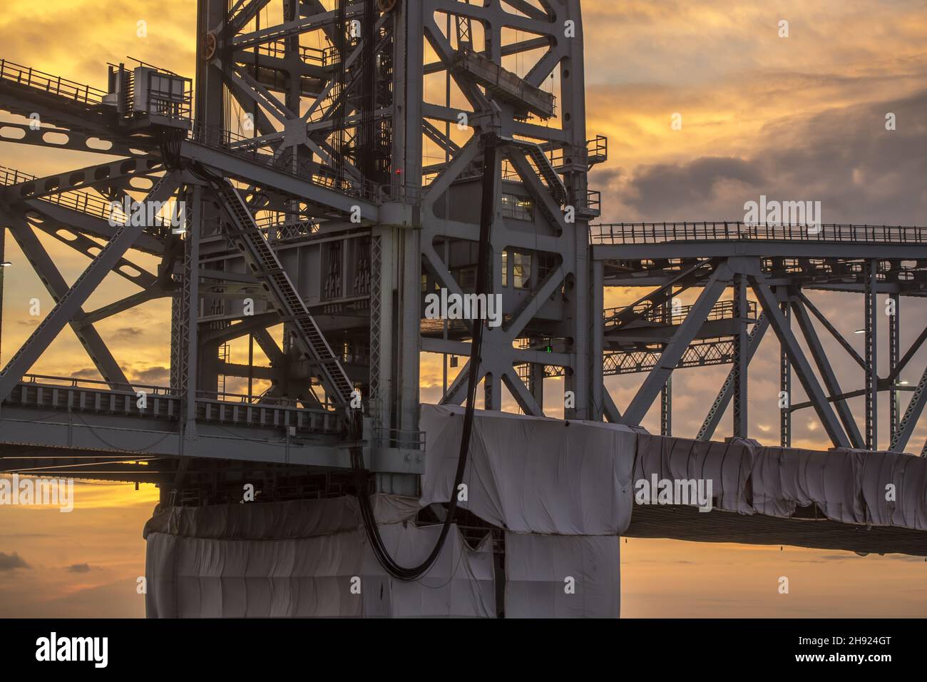 Metallic bridge on a bright sunset background Stock Photo - Alamy