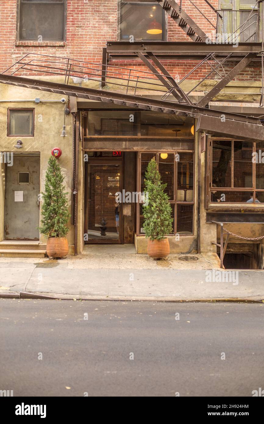Vertical shot of a cafe with a glass door on the street Stock Photo - Alamy