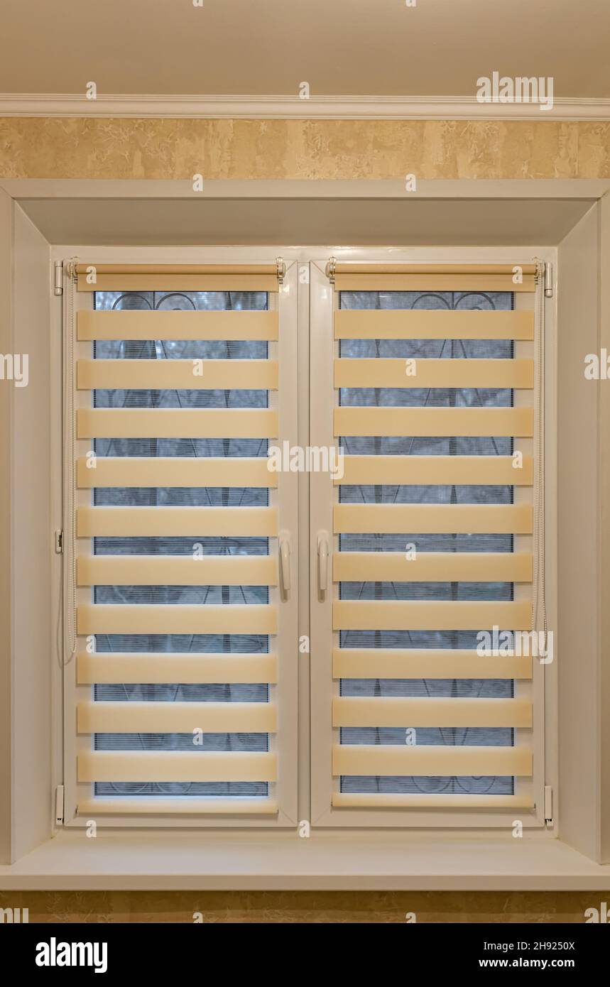window half closed with striped blinds day-night. High quality photo ...