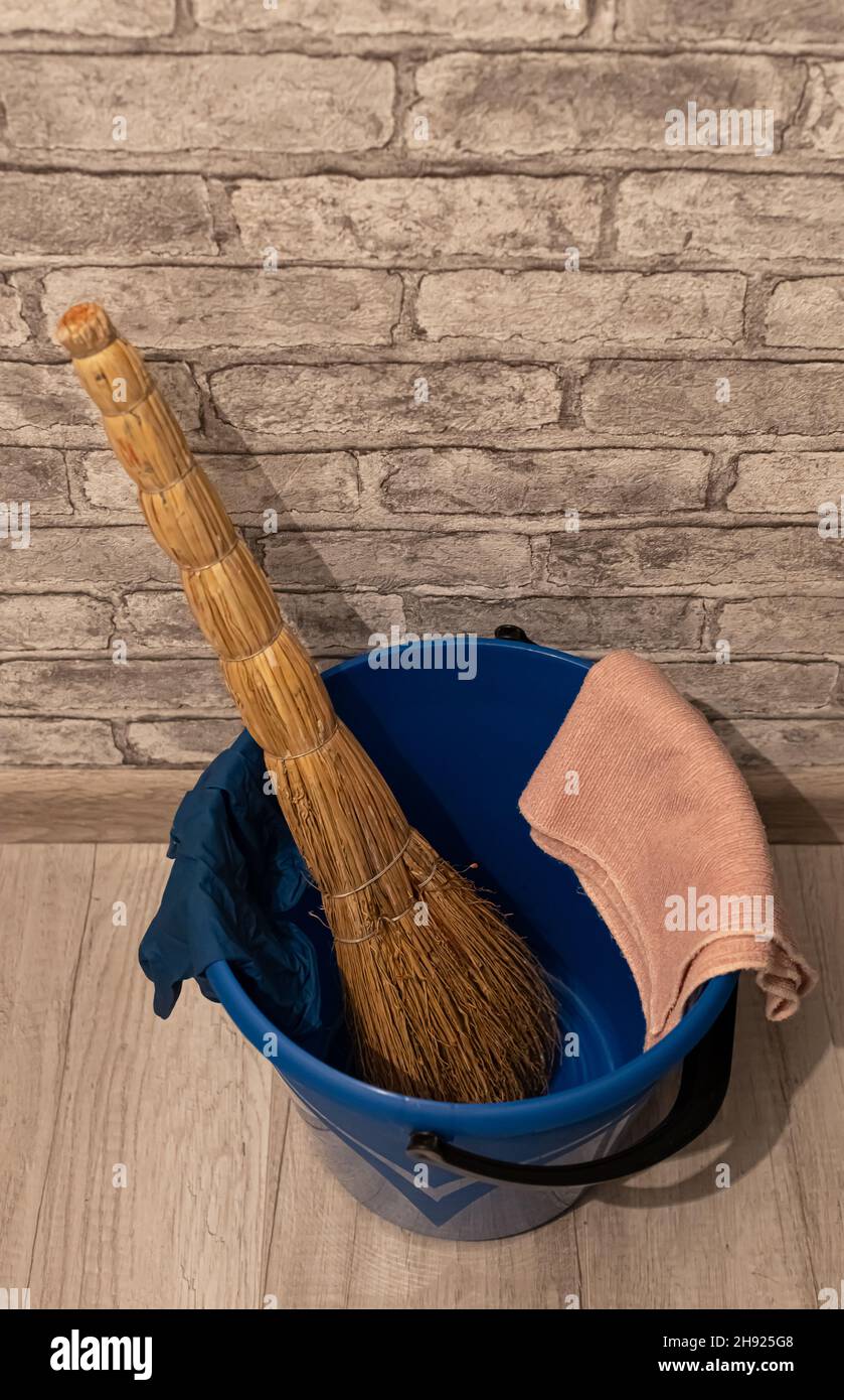 broom rag and gloves lying in a plastic bucket Stock Photo - Alamy