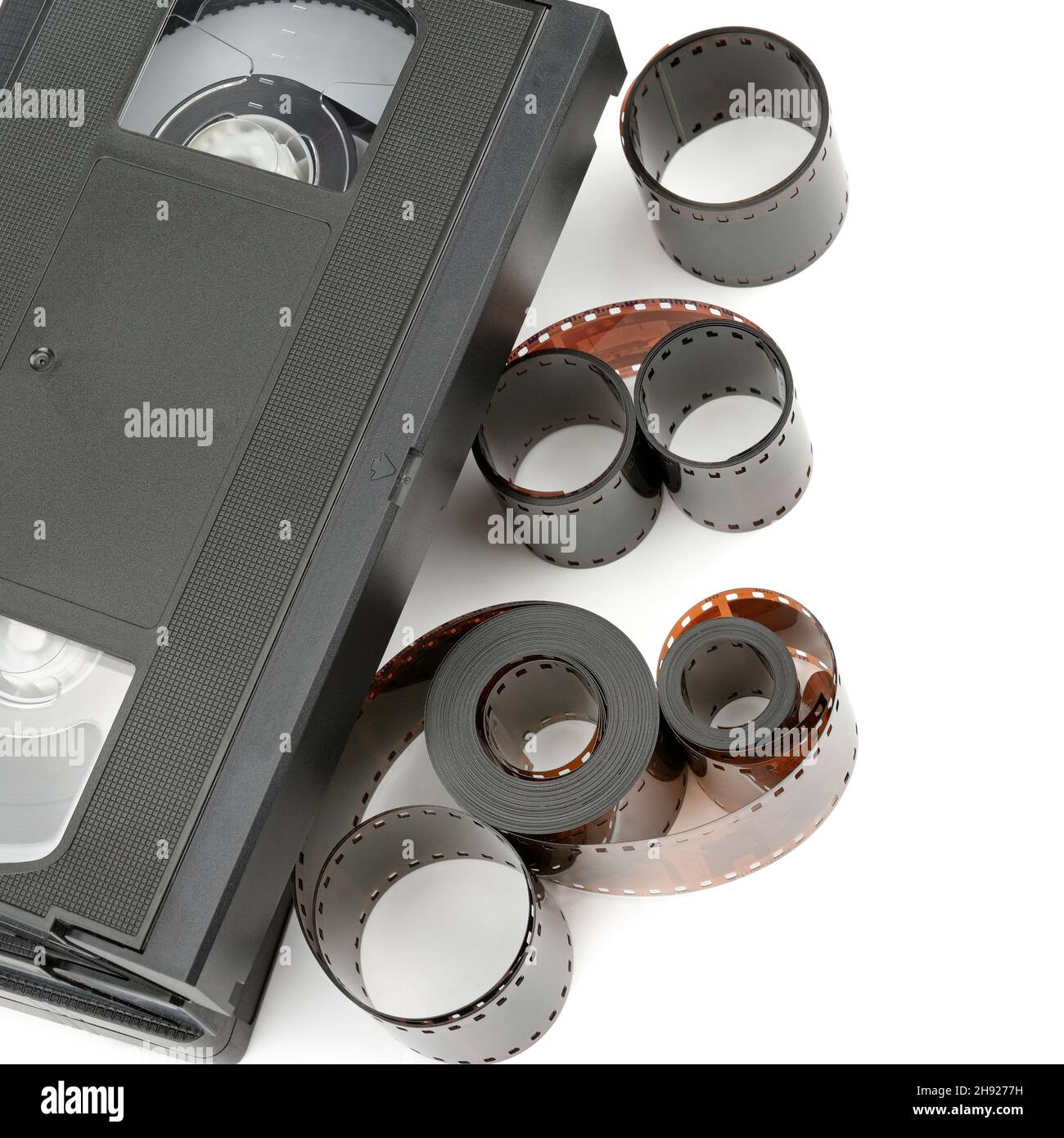 A set of video tapes and photographic film isolated on white background ...