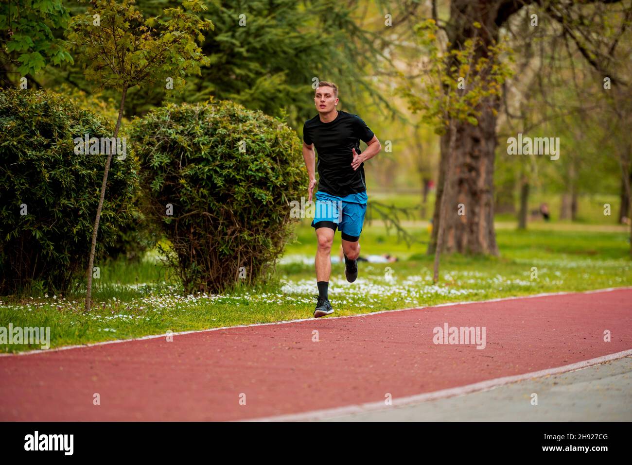 Runner Man running with concentration, determination and strength ...