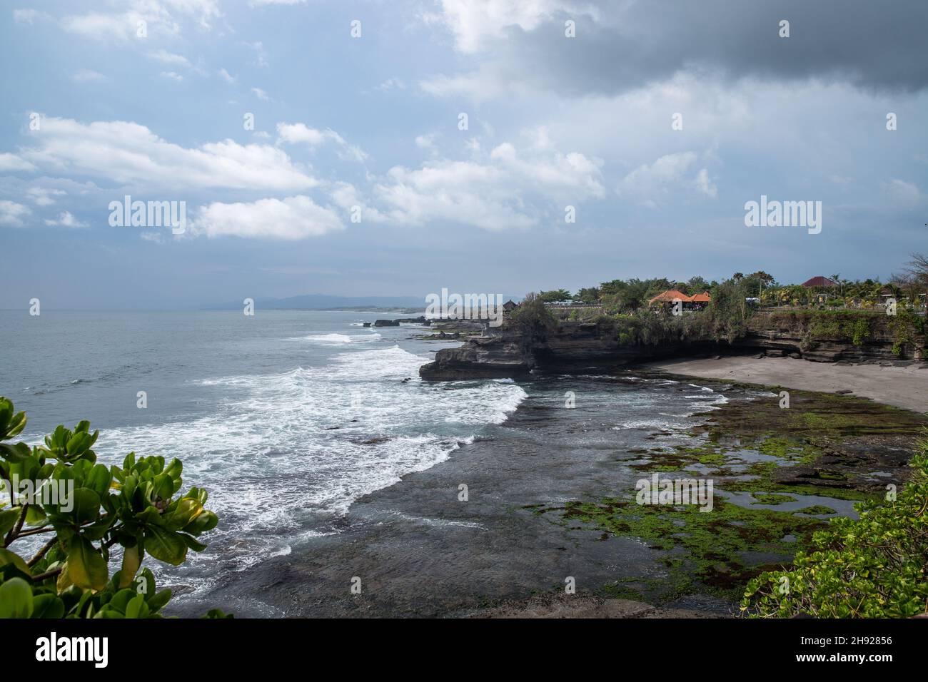 Cloudy blue sky over the sea captured from the coast in Bali, Indonesia ...