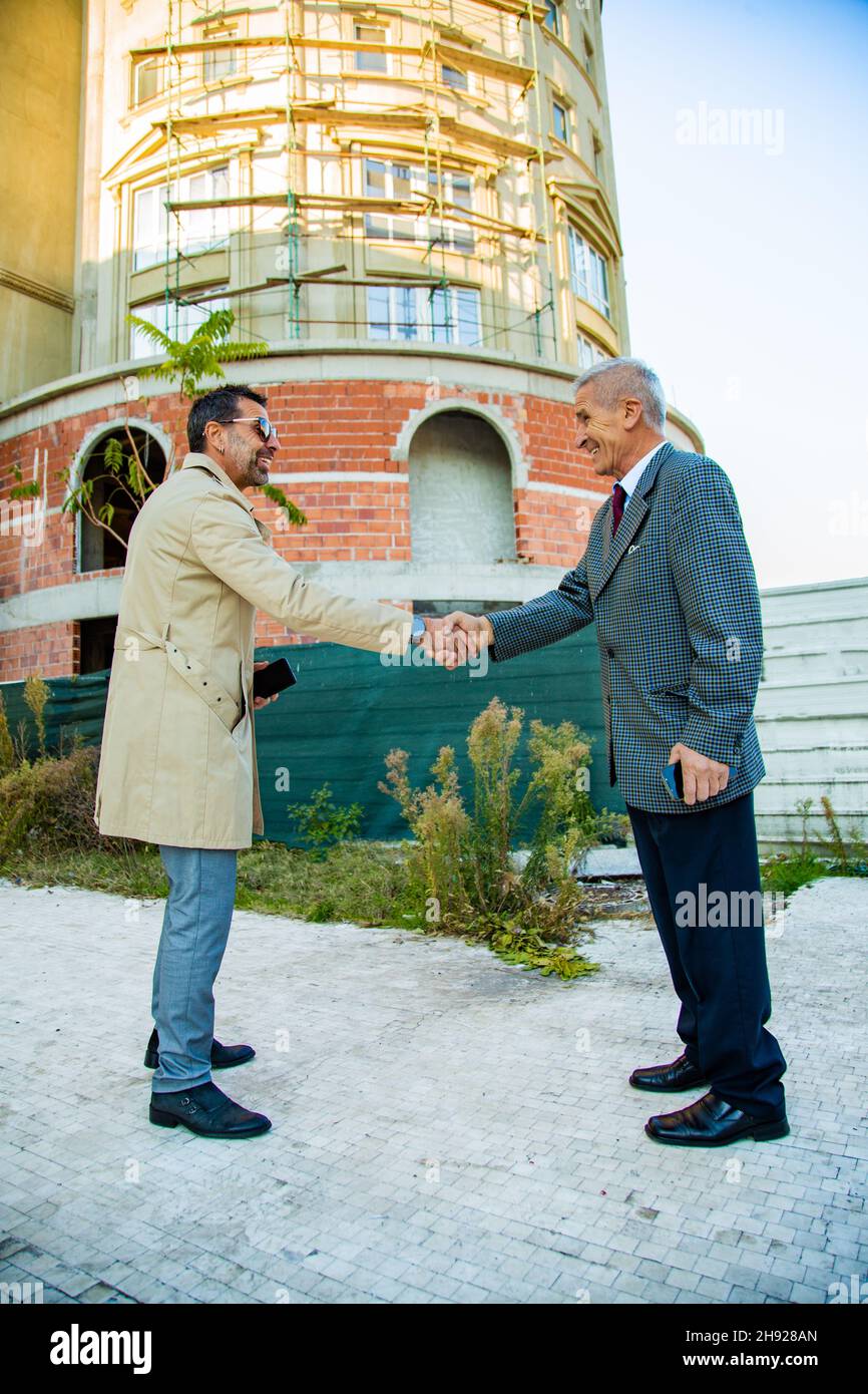 Two business people doing handshake hi-res stock photography and images ...