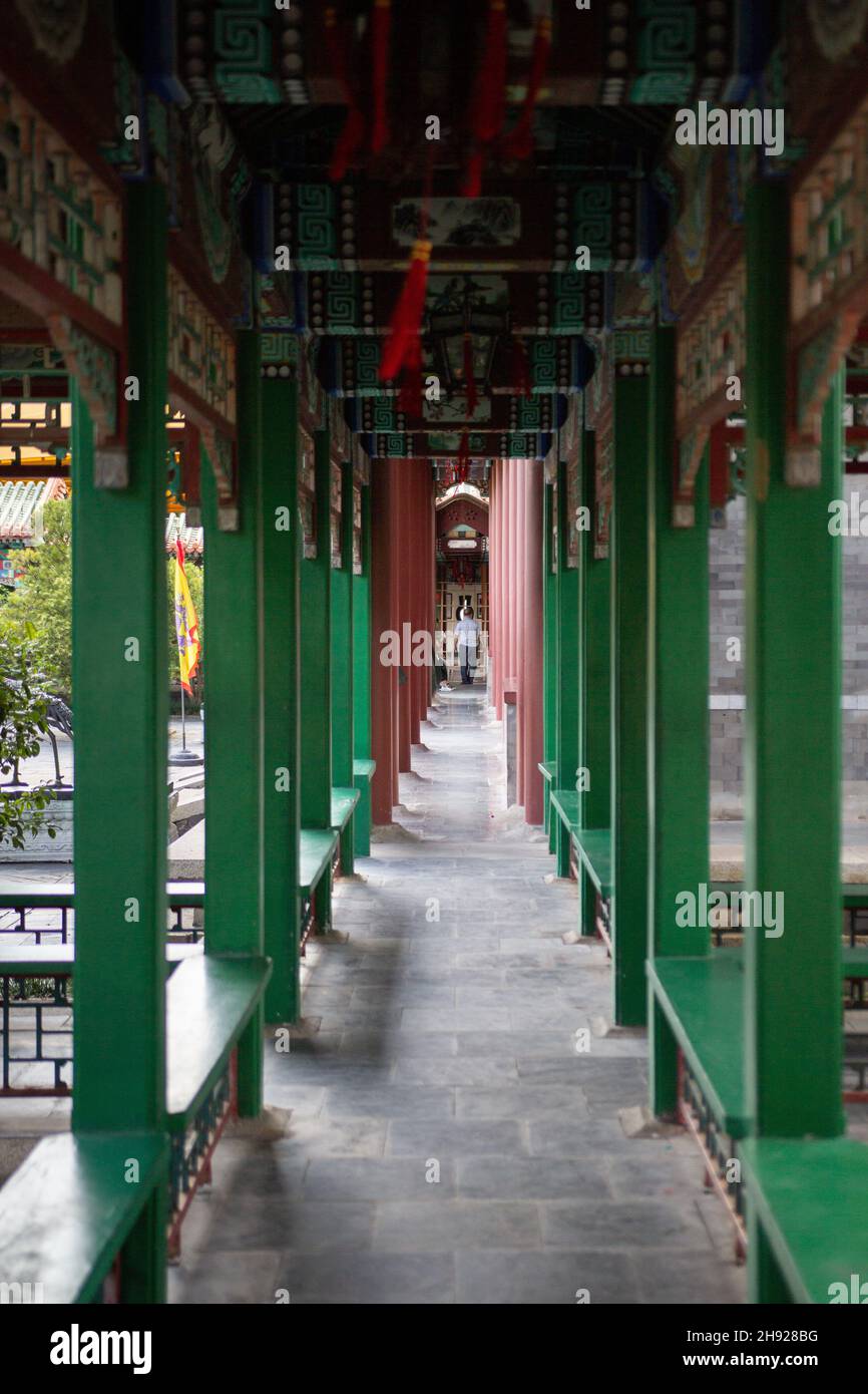 Vertical shot of a narrow footpath in a temple in Shenzhen, China Stock ...