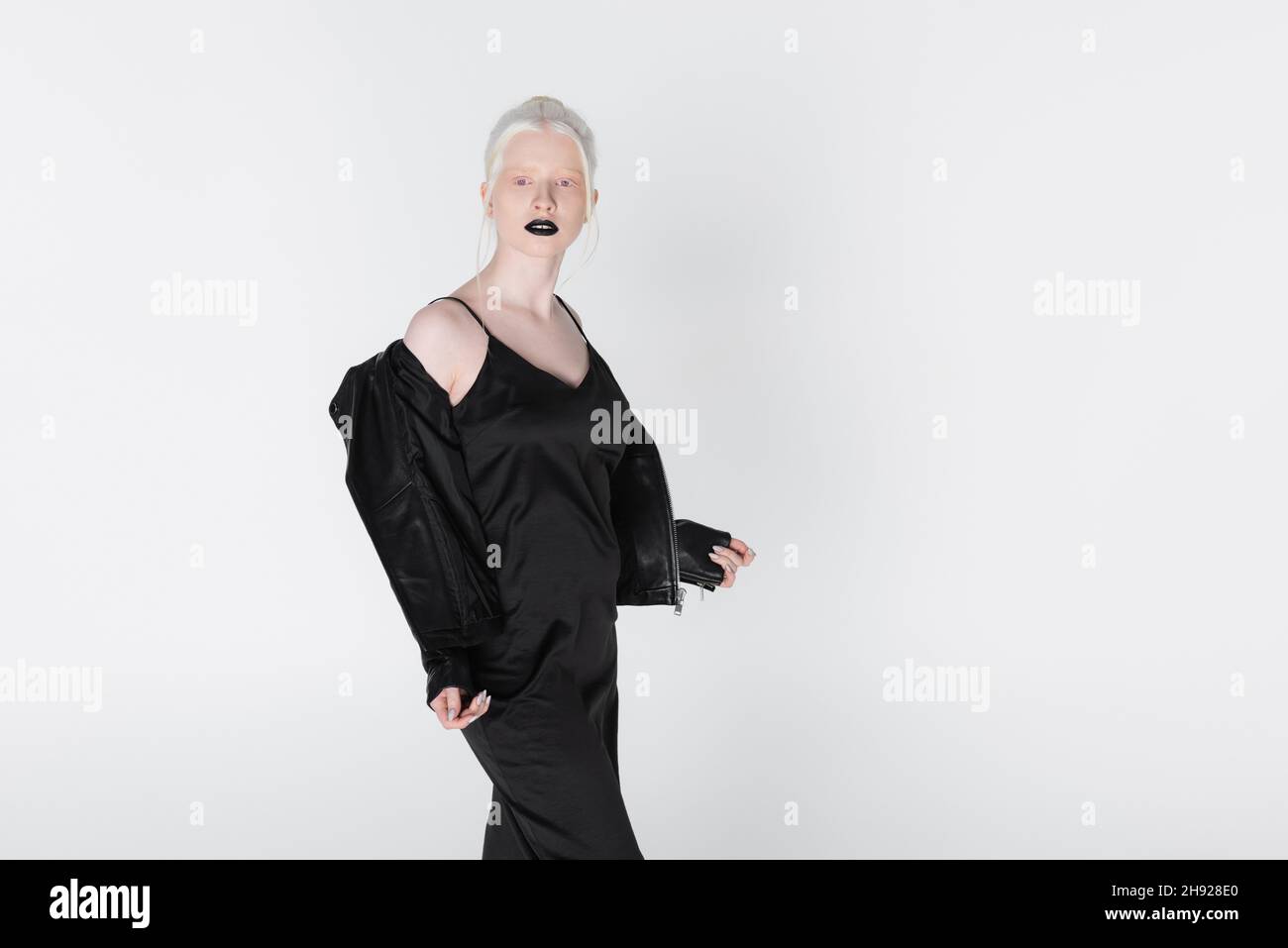 Woman taking off jacket hi-res stock photography and images - Alamy